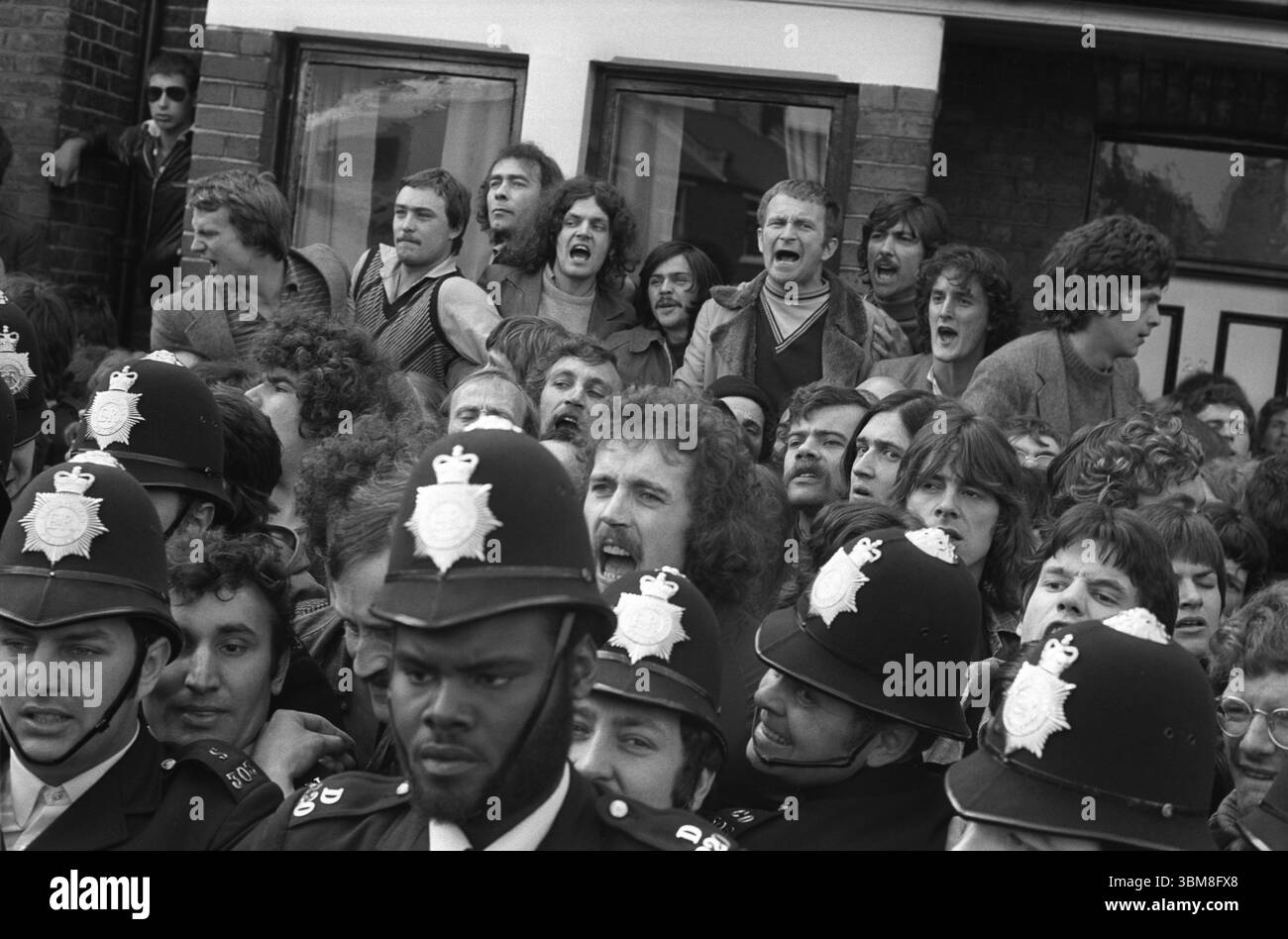 Grunwick dispute, crowds of demonstrators shouting "scabs" as bus loads ...