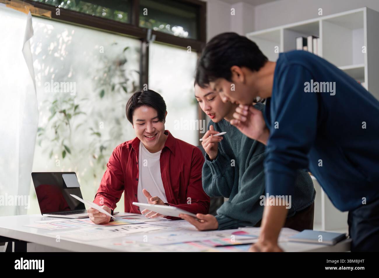 Creative Collaboration in UIUX. Diverse team members engaging in design ...