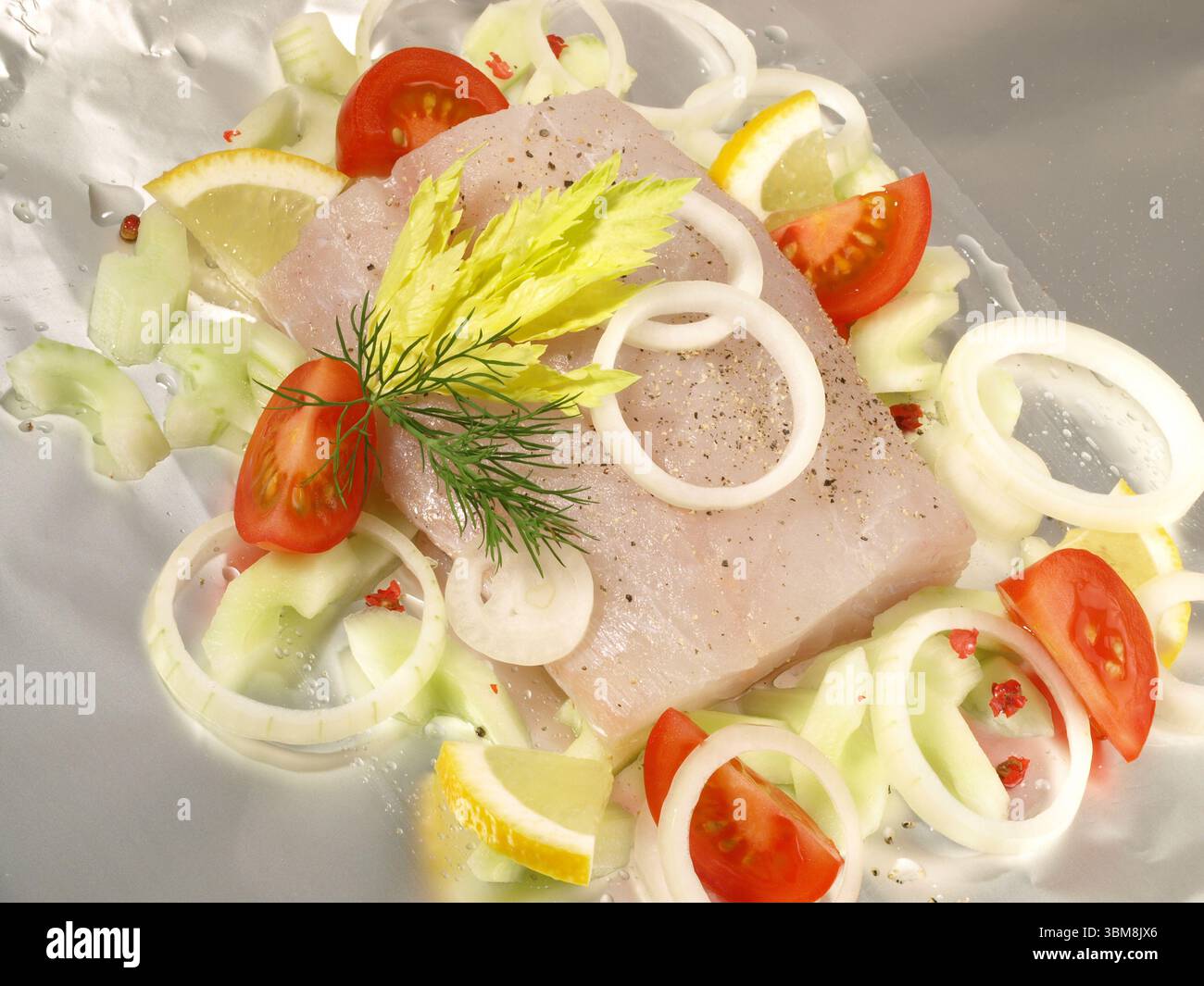 Preparing Pollack Fish for cooking in Aluminum Foil Stock Photo - Alamy