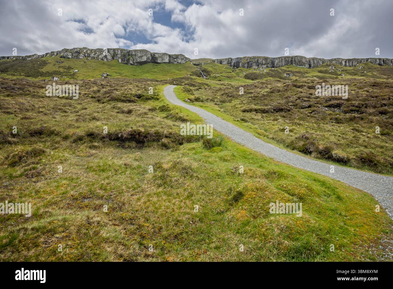Craggy cliffs and waterfall in Toftavatn park in Runavik, Faroe Islands ...