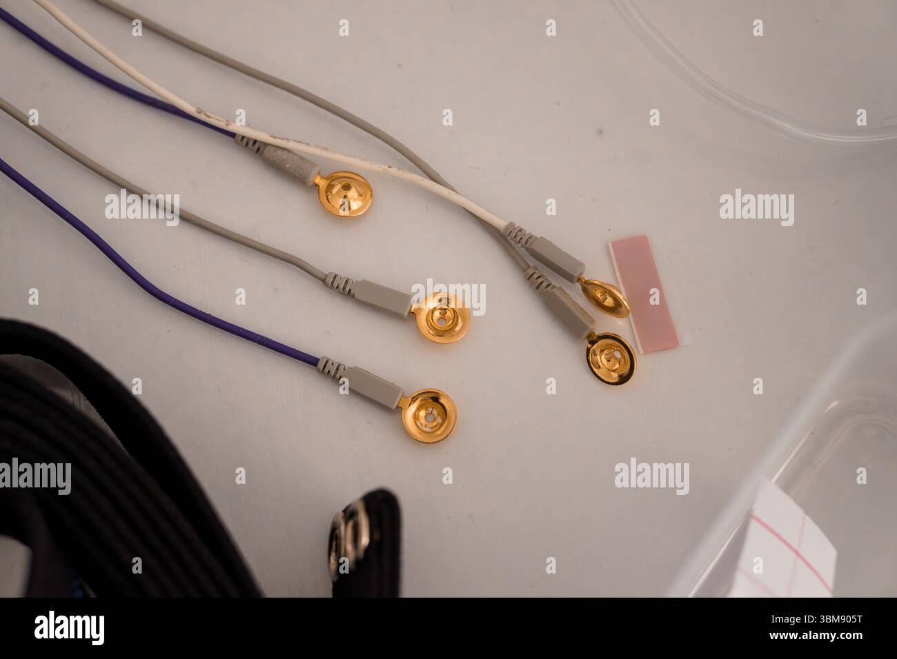 Polysomnography Setup Close-Up: EEG Electrode Connections on White ...