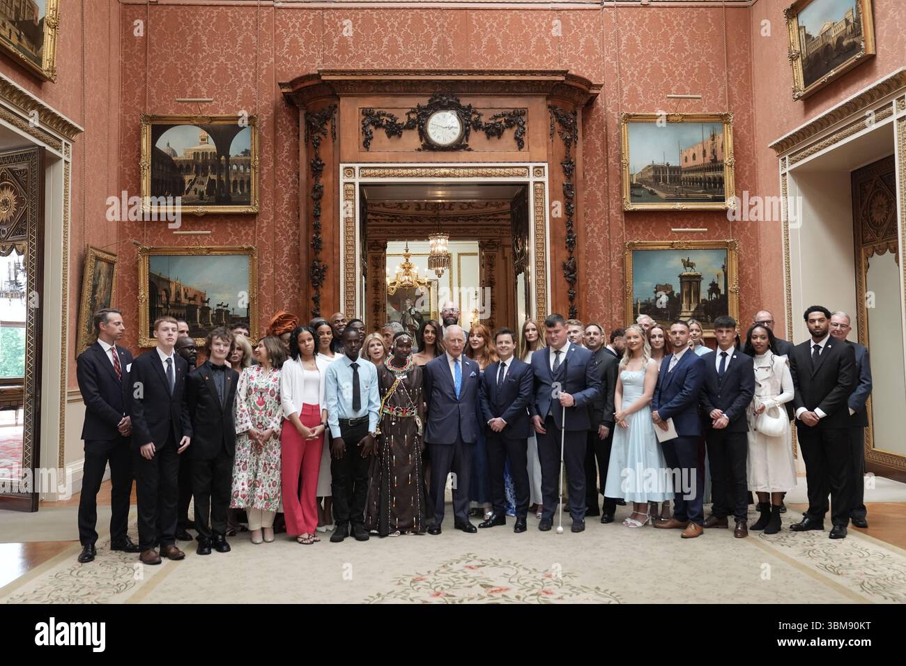 King Charles III (front centre) poses with winners of the King's Trust ...