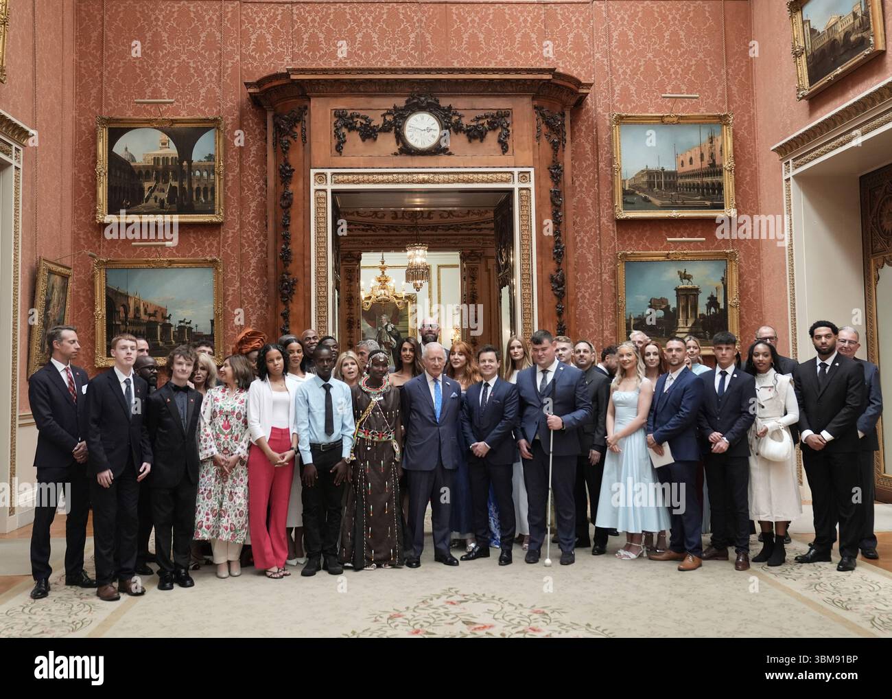 Britain's King Charles III, center, poses with winners of the King's ...