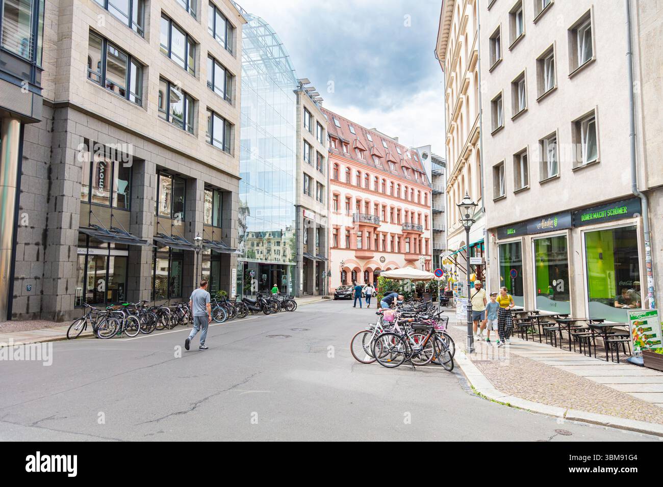 Leipzig, Germany – June 7, 2025: Urban street scene with pedestrians ...