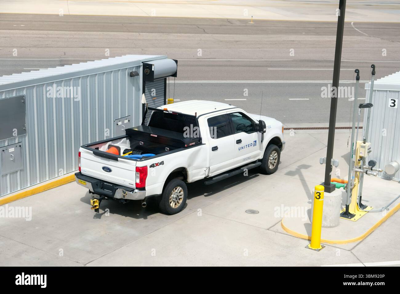 United Airlines truck vehicle at a loading dock of the airport Stock ...
