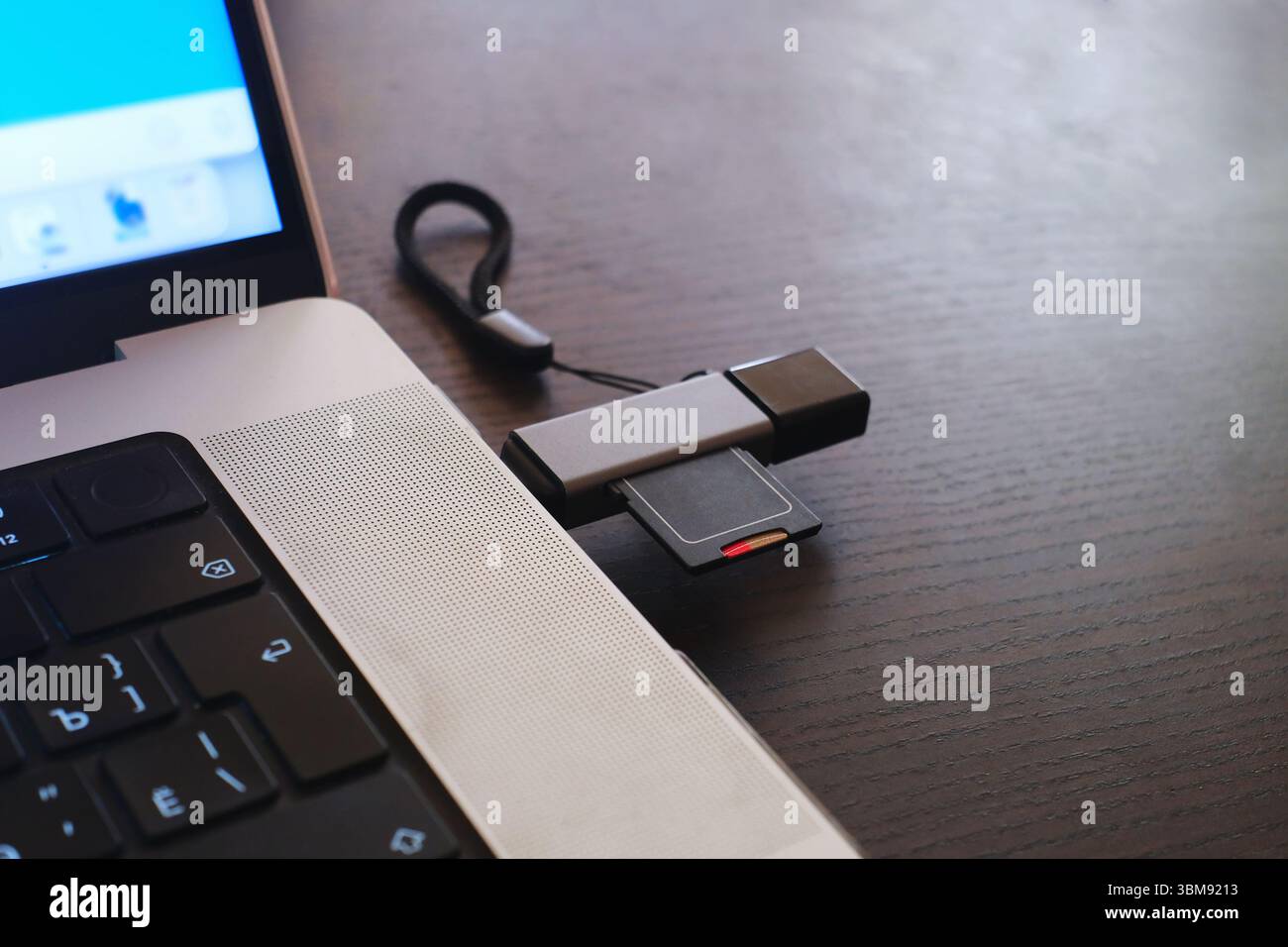 SD card Storage drive connected to a laptop with a USB card reader ...