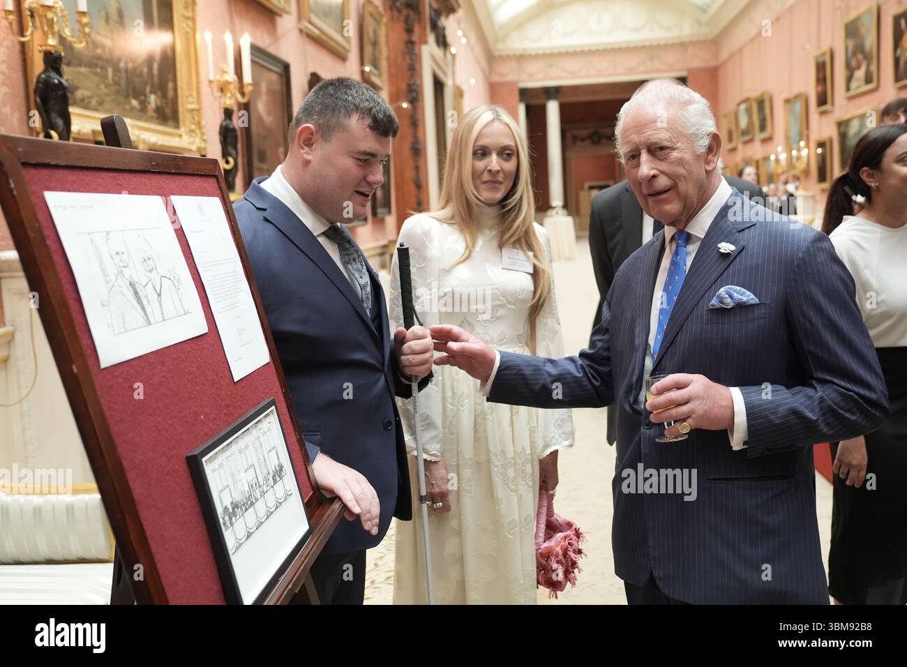 King Charles III speaks with award winner Brendan Hulcoop as Fearne ...