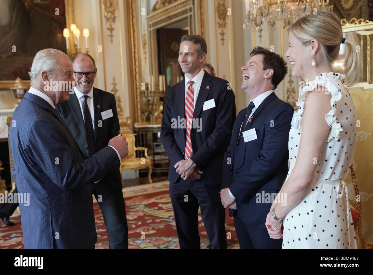 King Charles III speaks with Will Straw (third right) and Declan ...