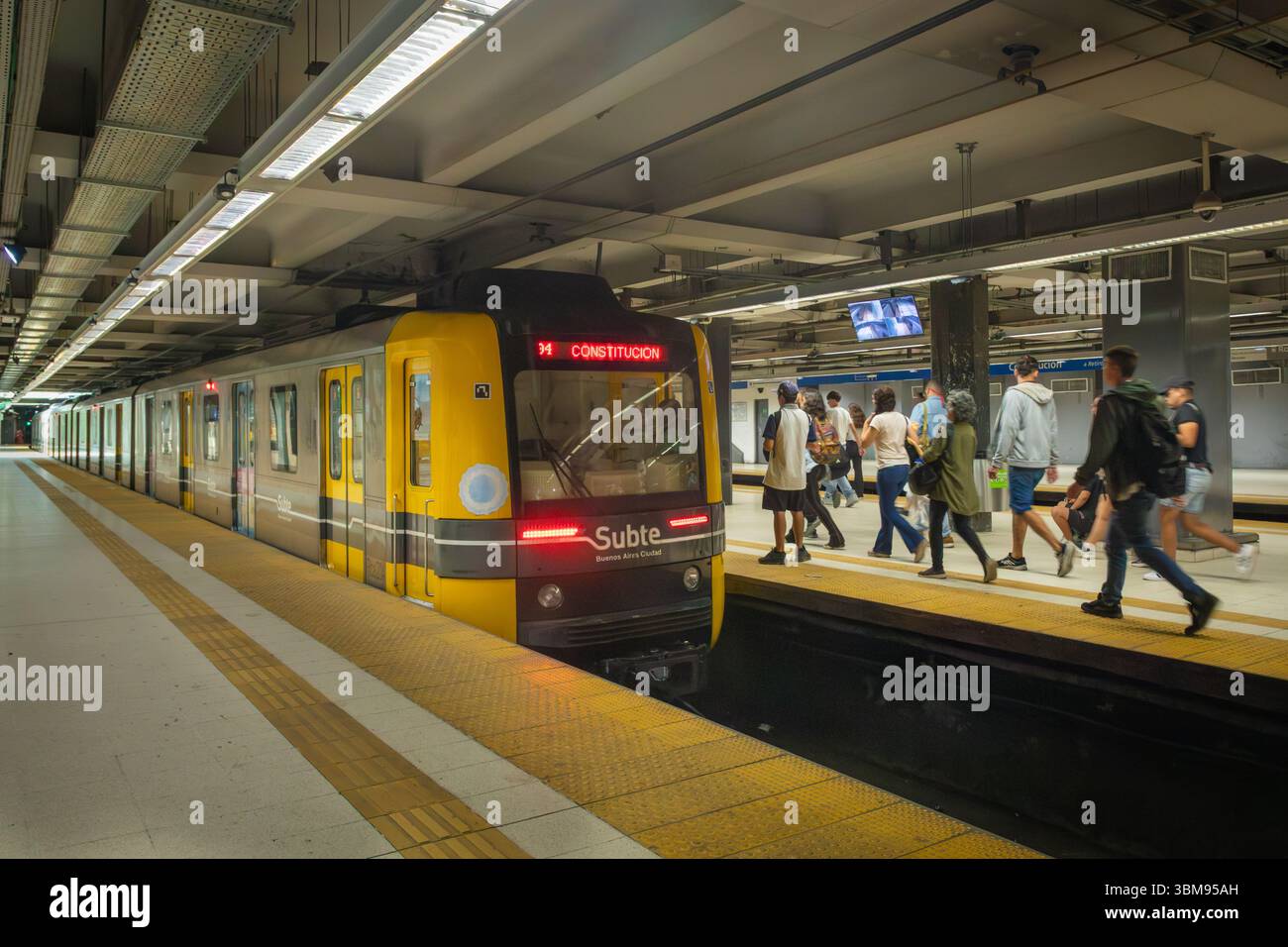 Passengers prepare to board a subway train in Buenos Aires. The subway ...