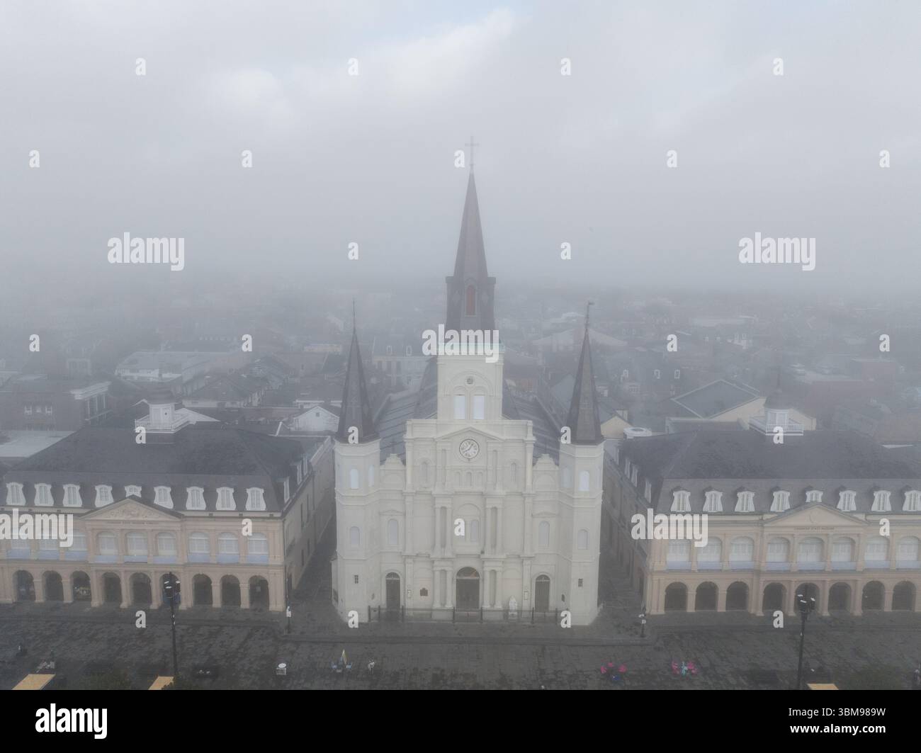 Aerial drone view of St. Louis Cathedral and Jackson Square shrouded in ...