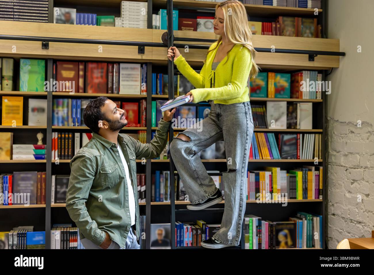 Multicultural friends in library Stock Photo - Alamy