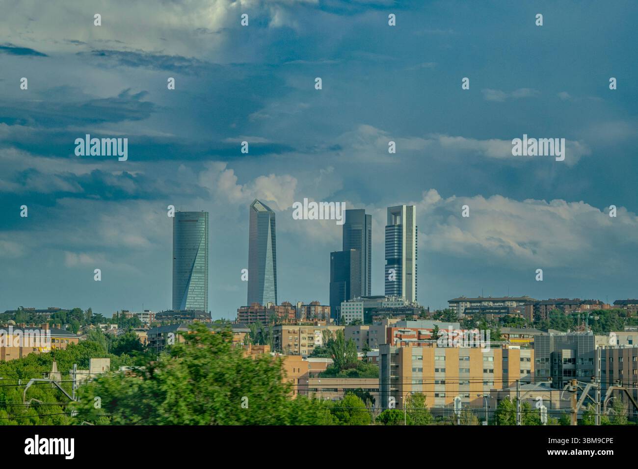 Telephoto view of a modern city skyline with several tall buildings ...