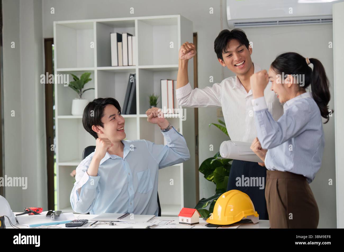 Team Collaboration and Celebration. Two colleagues celebrate their ...