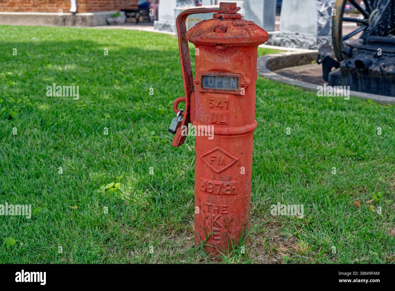 Still in use a municipal old fire hydrant painted bright red with a ...