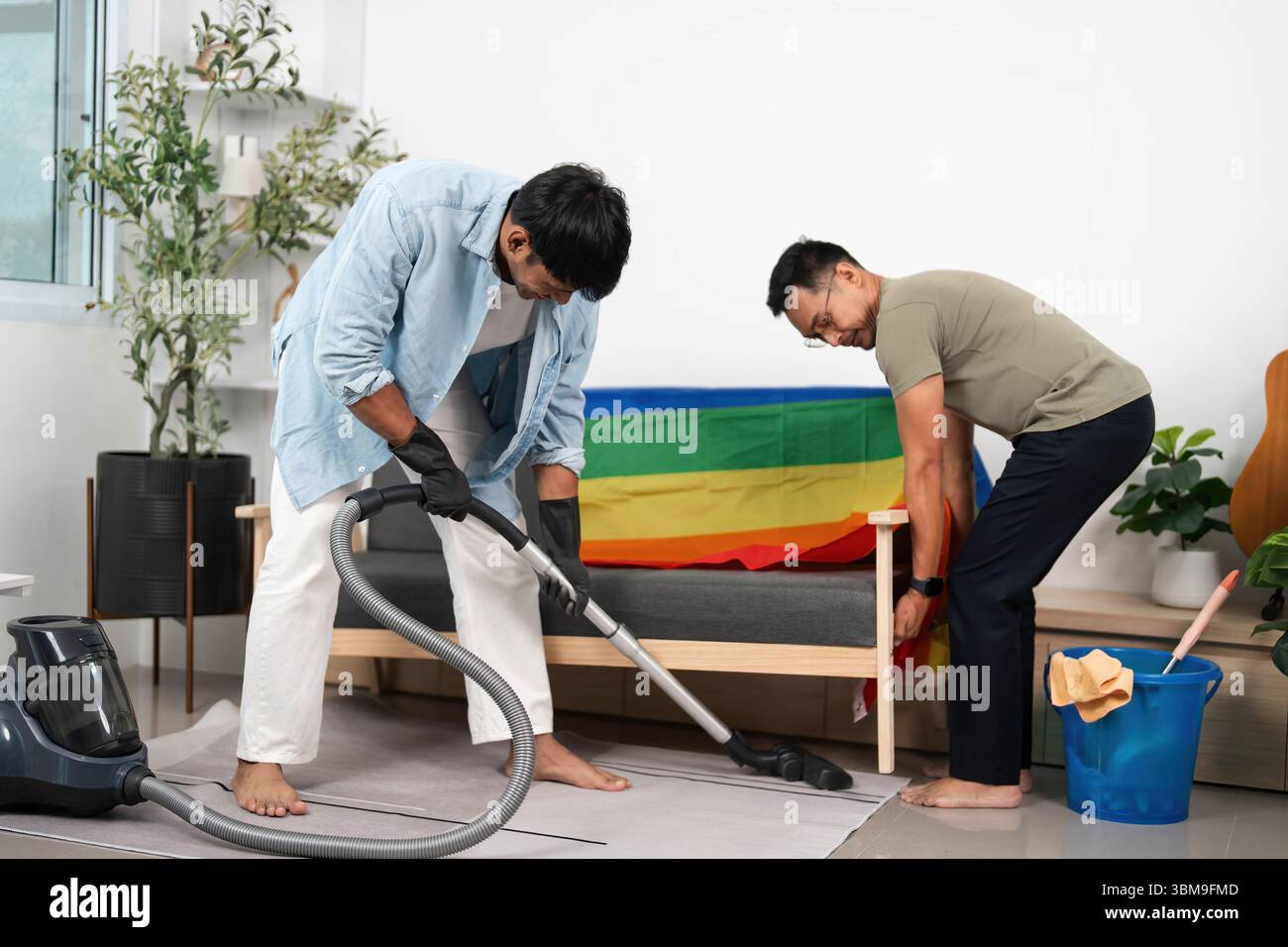 Inclusive Cleaning. Friends vacuuming and organizing their shared ...