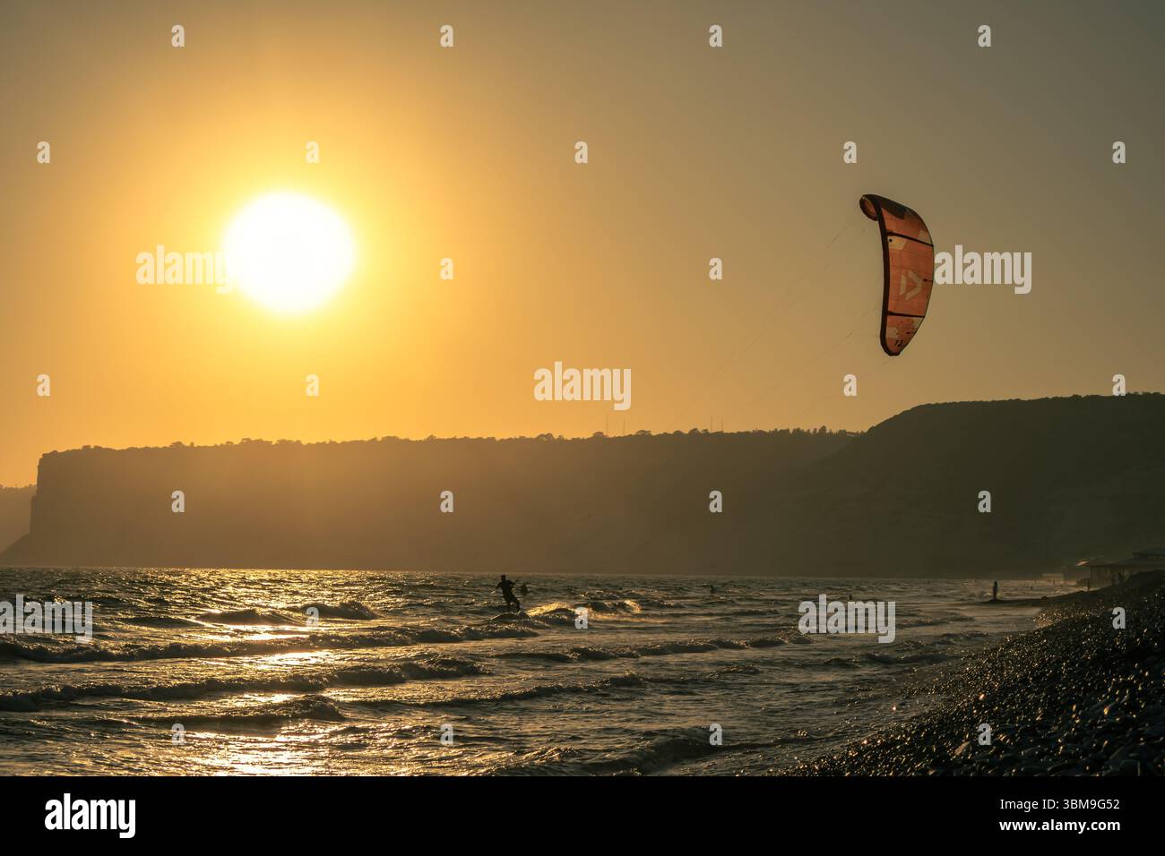 Limassol, Cyprus, 06-20-2025. A young man doing kite surfing on the ...