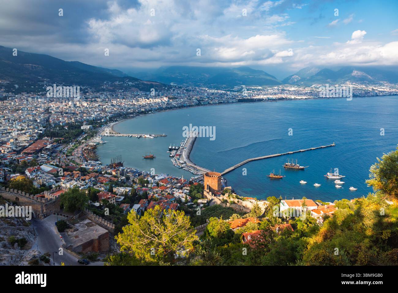 Elevated view of the harbor in Alanya, Turkey, featuring the iconic Red ...