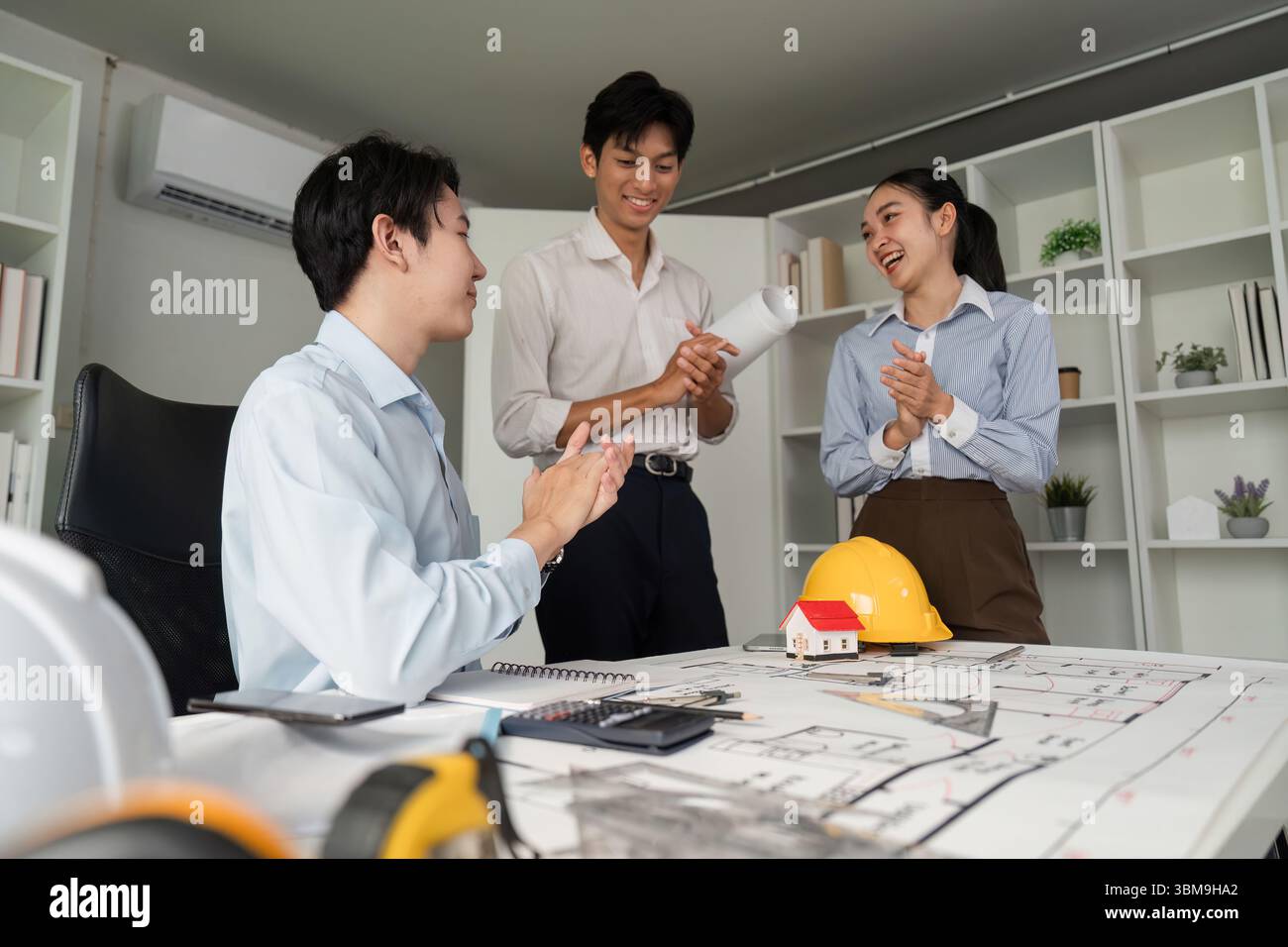 Project Completion and Team Spirit. A team celebrating their successful ...