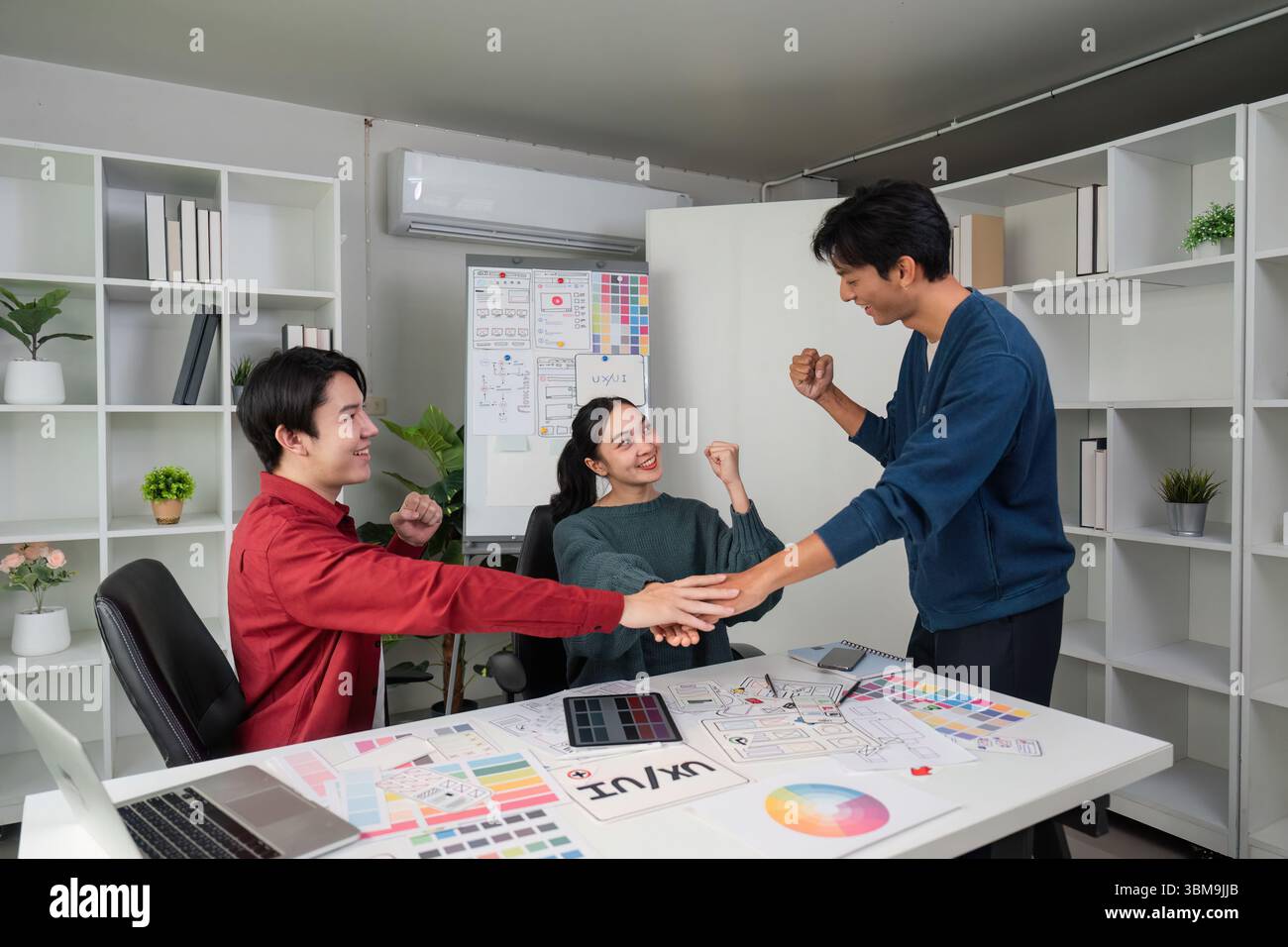 Celebration and Team Success. Team members celebrating a successful ...
