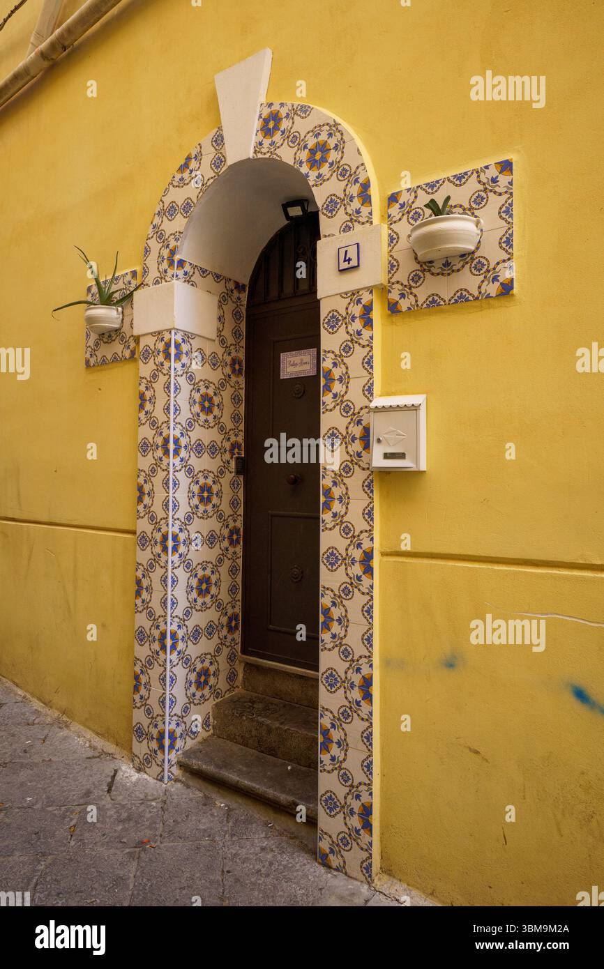 This image captures a picturesque entrance in the heart of Ballarò ...