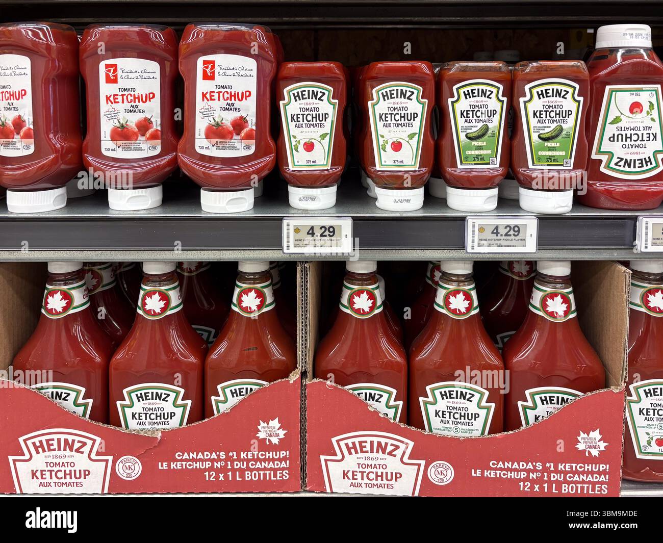 Ketchup bottles including Heinz and President's Choice brands displayed ...
