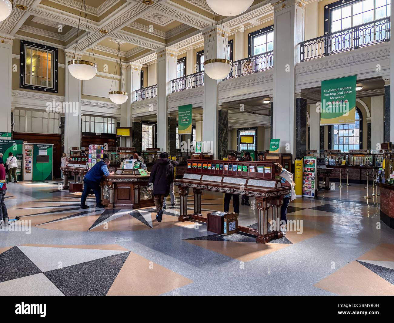 General Post Office interior in Dublin, Ireland. Customers and staff ...