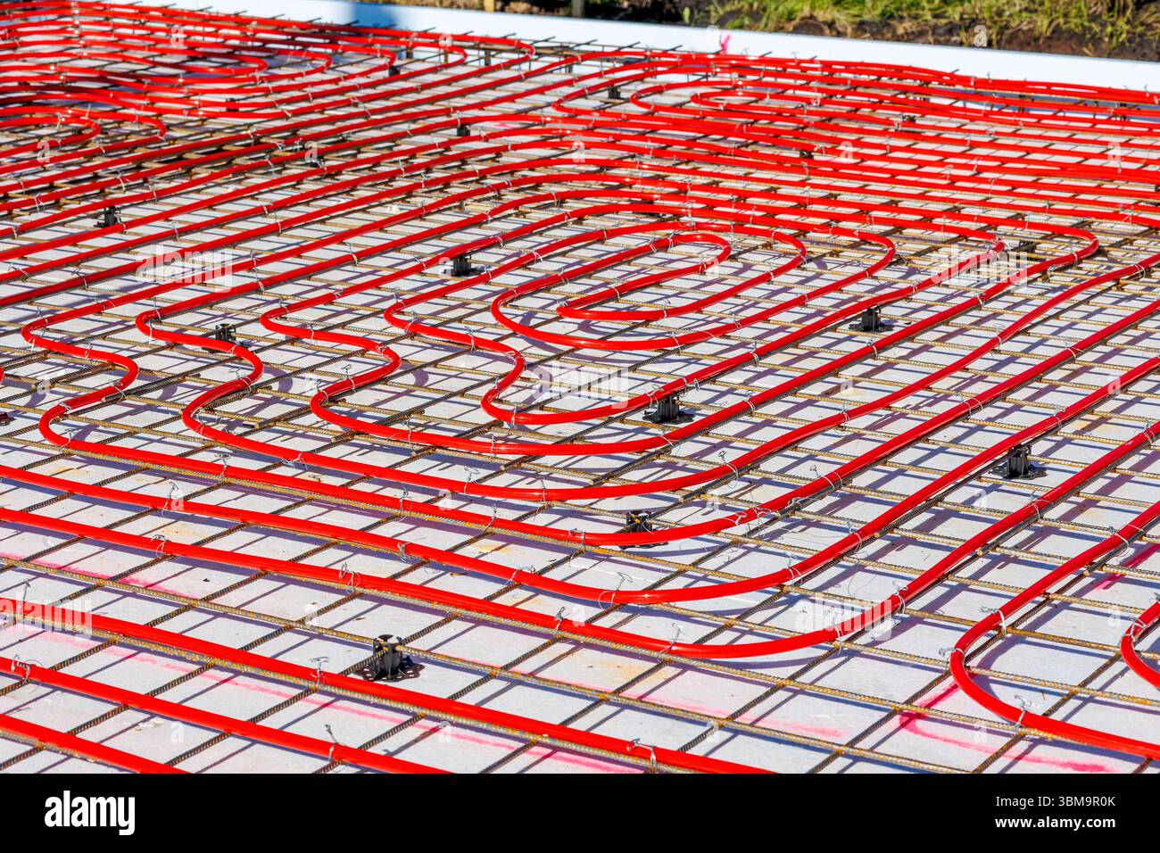 Underfloor heating system with red pipes on construction site Stock ...