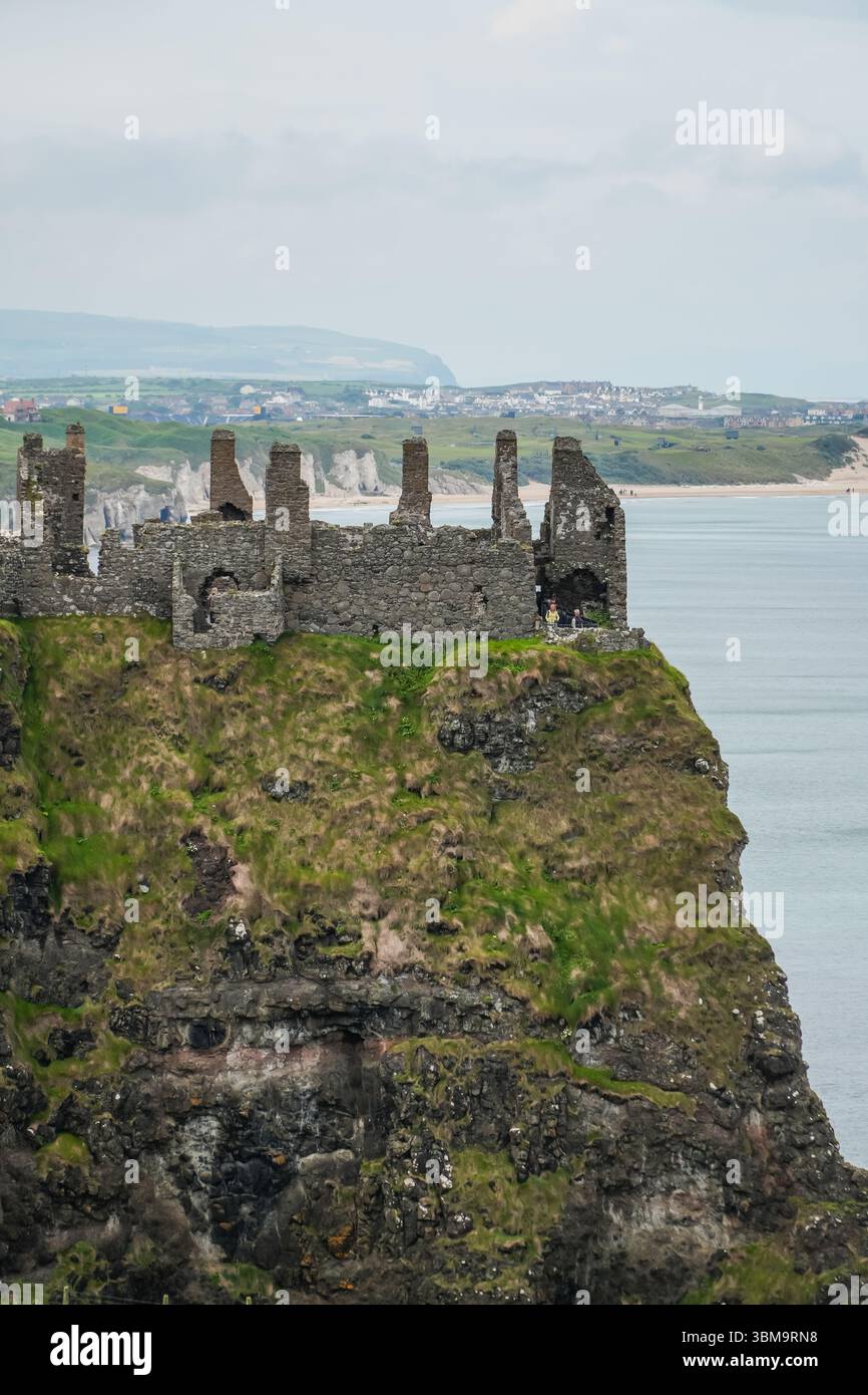 Dunluce castle is a medieval ruin on a coastal cliff along the Causeway ...