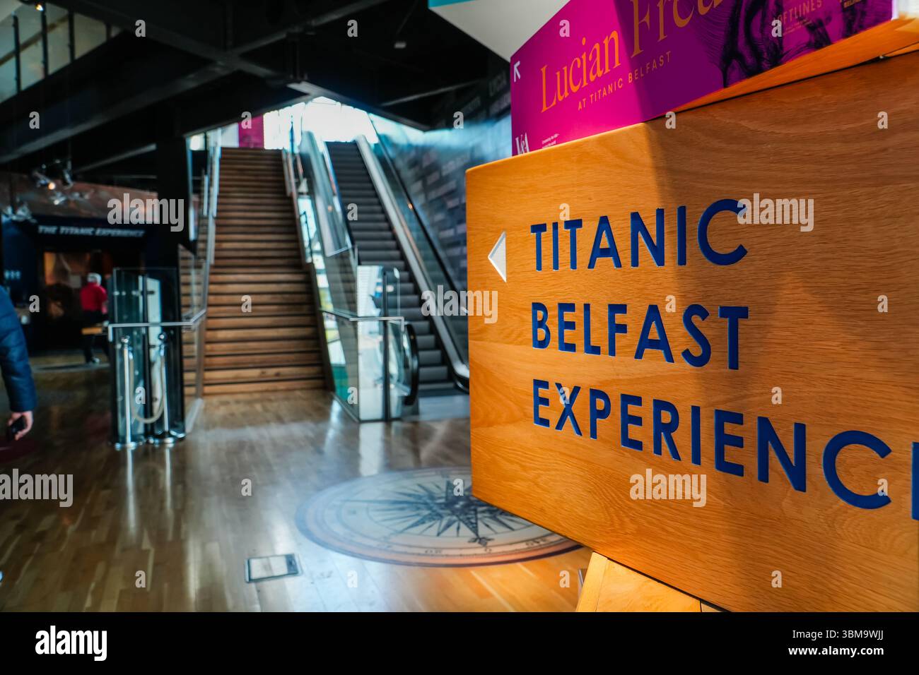 Titanic Belfast Experience. Sign directing visitors inside the modern ...