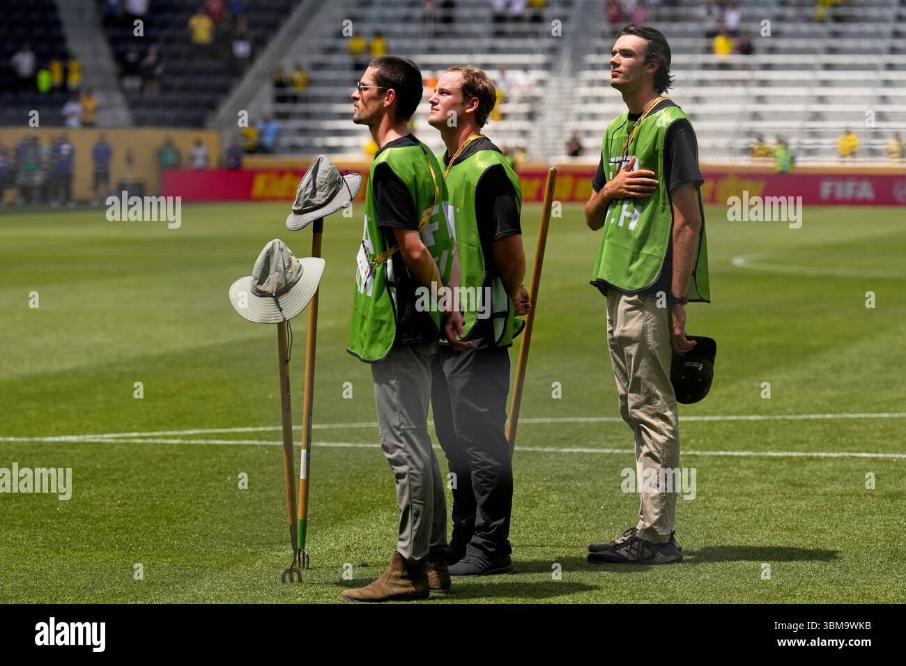 The grounds crew is seen during the national anthem before the Club ...
