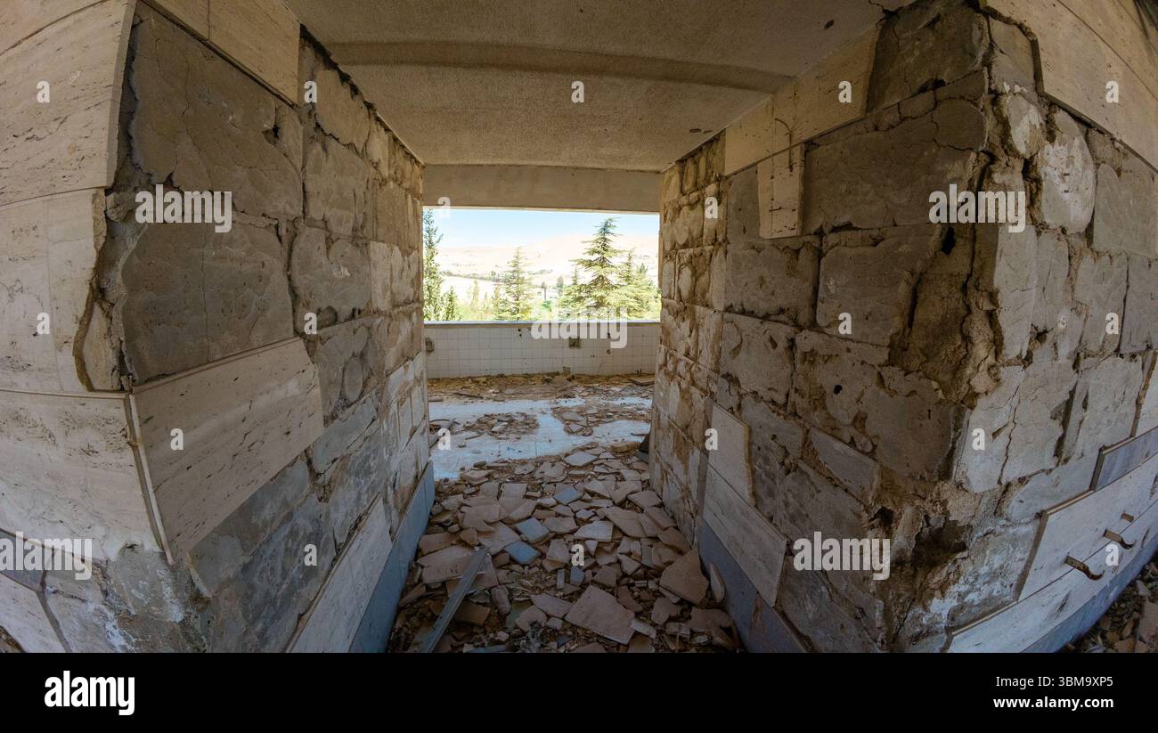 Abandoned building interior with crumbling walls and debris on the ...
