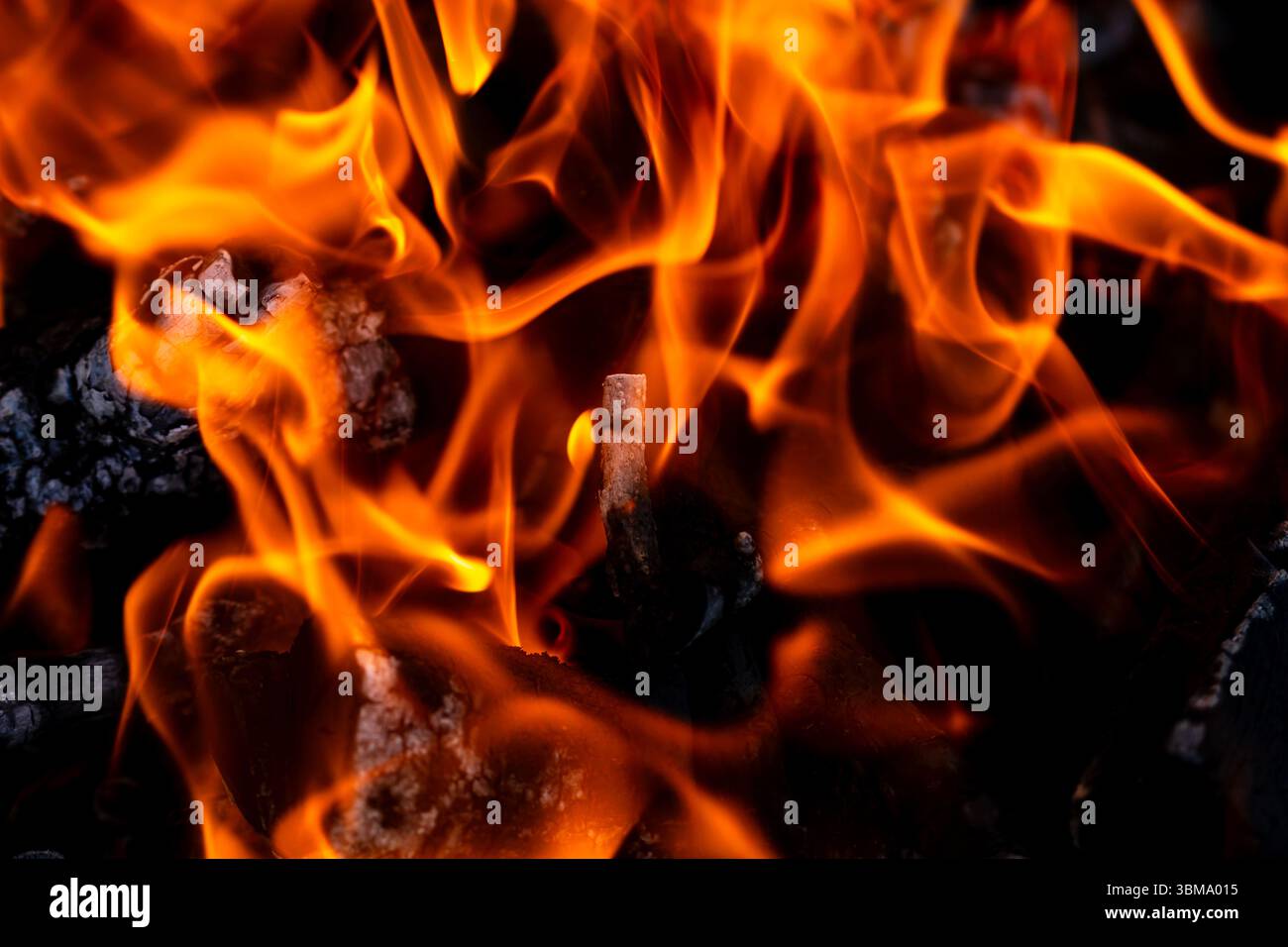 BBQ grill with burning wood and fire flames. Empty hot charcoal ...