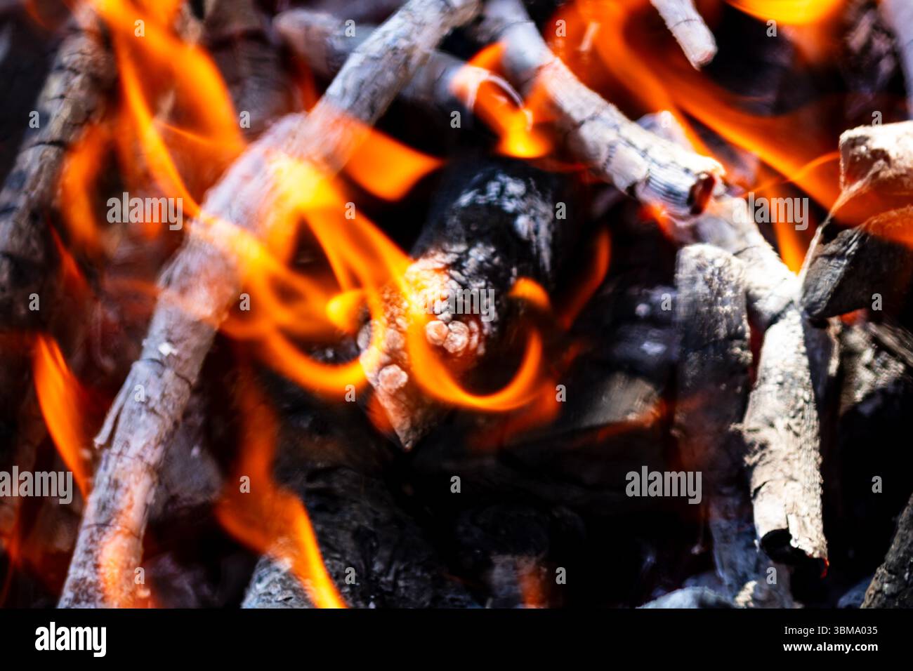 BBQ grill with burning wood and fire flames. Empty hot charcoal ...