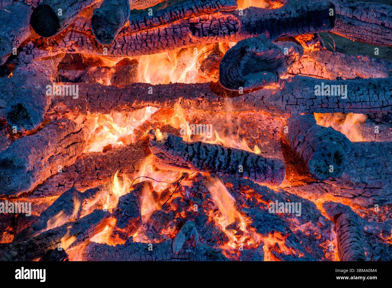 Embers burning in a bonfire during a religious festival in honor of ...