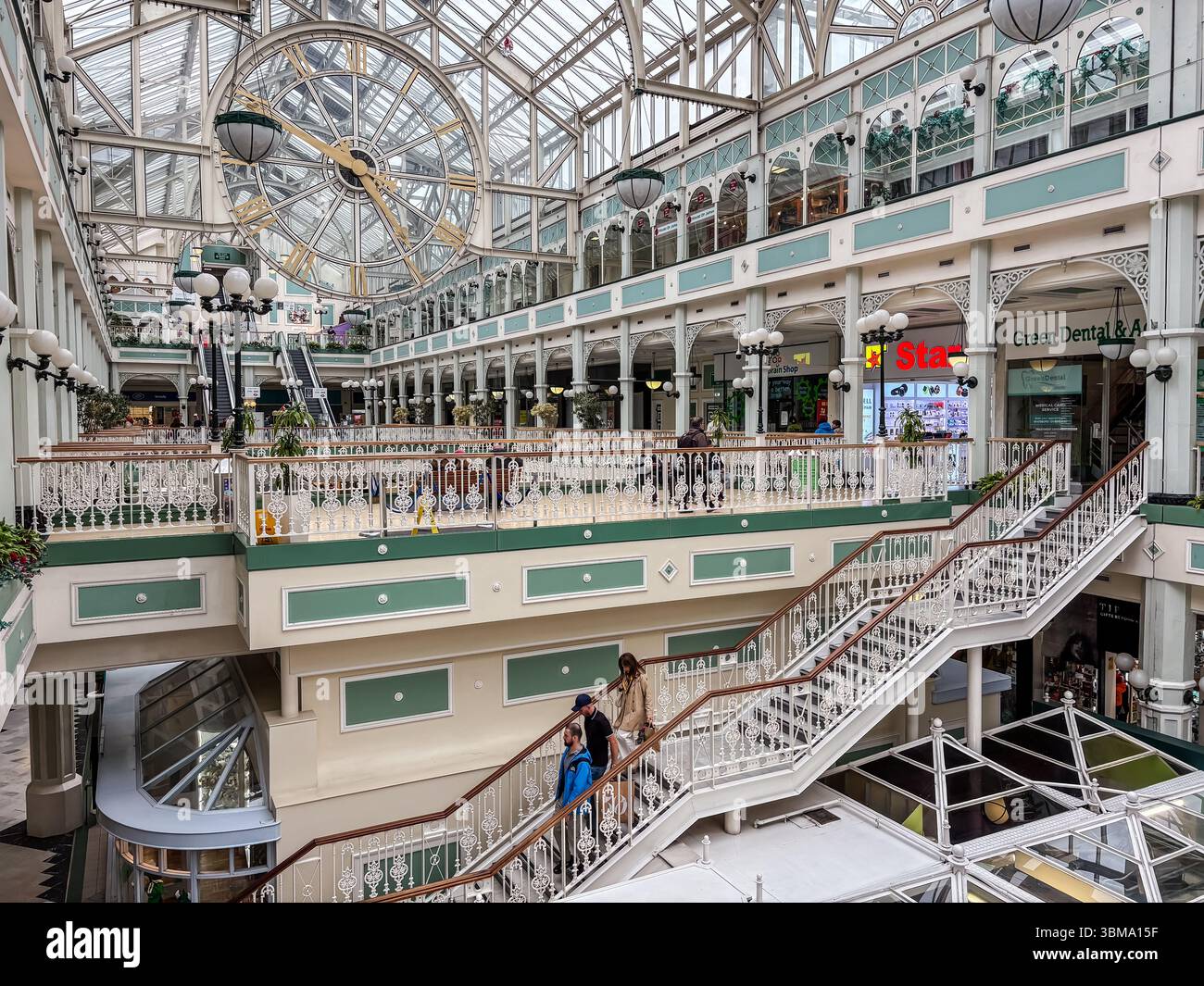 Stephen's Green Shopping Centre interior with grand clock, escalators ...