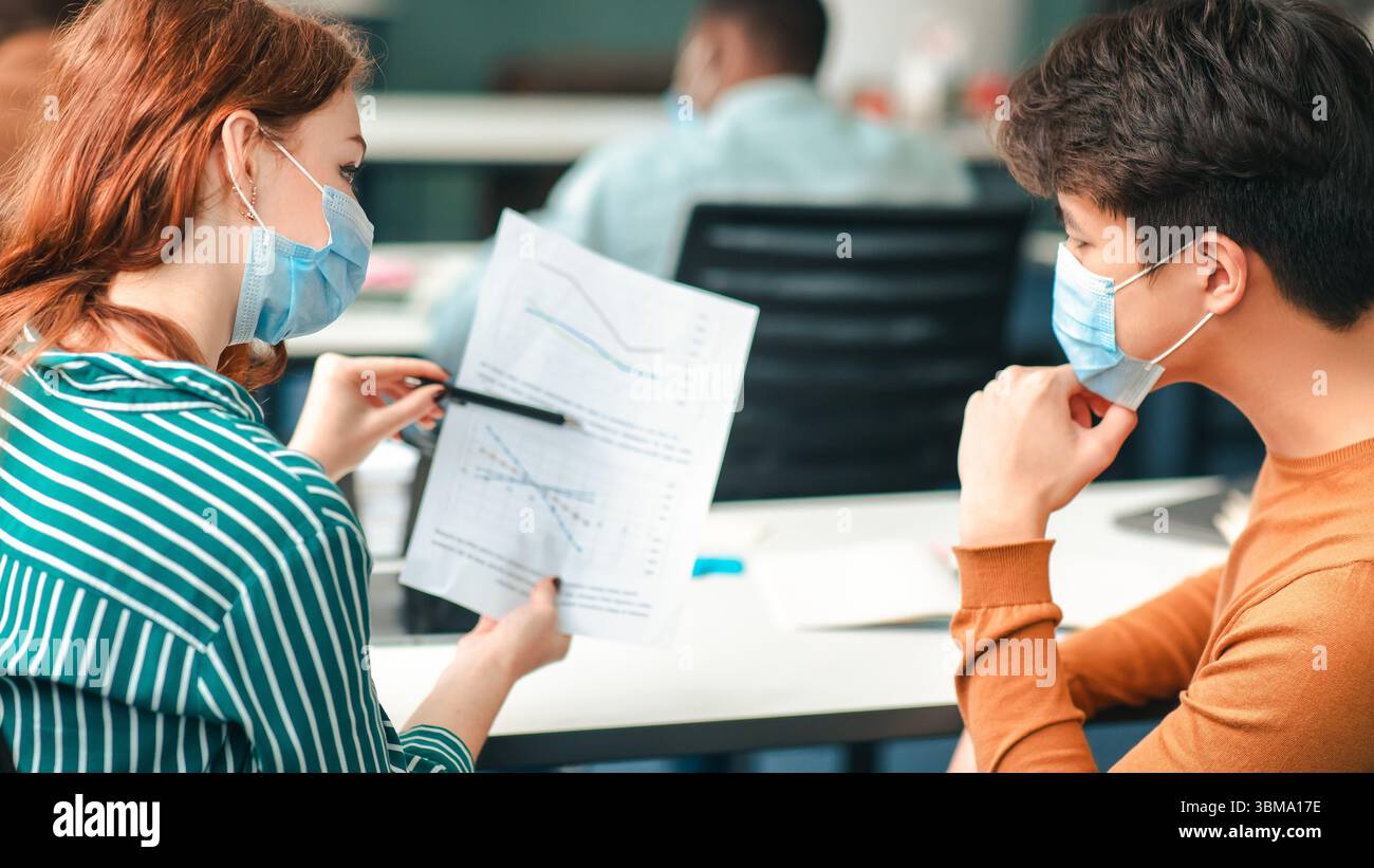International students wearing medical masks and talking Stock Photo ...