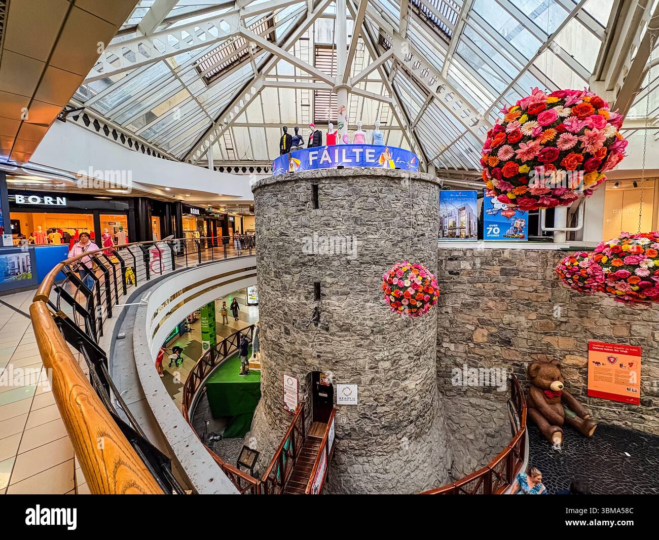 Eyre Square Centre, Galway. Interior view of a medieval tower and city wall section integrated ...