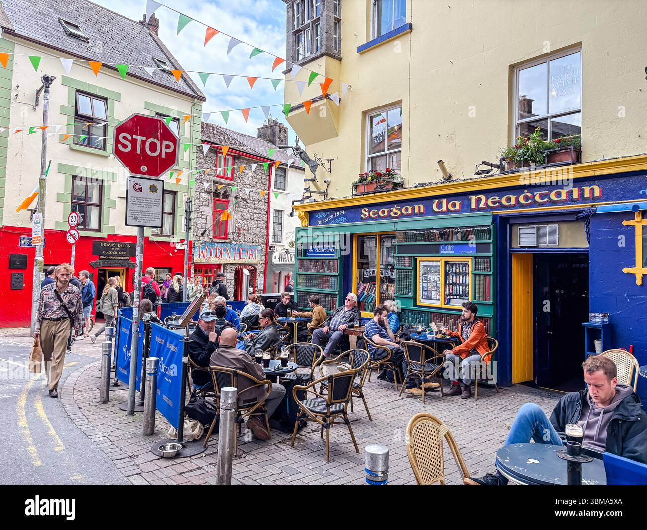 Shop Street, Galway. Lively street scene in Ireland showing people at ...