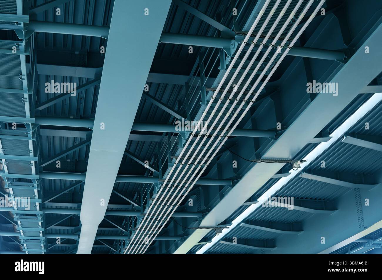 view from below of the bridge supporting beams, close up of steel ...