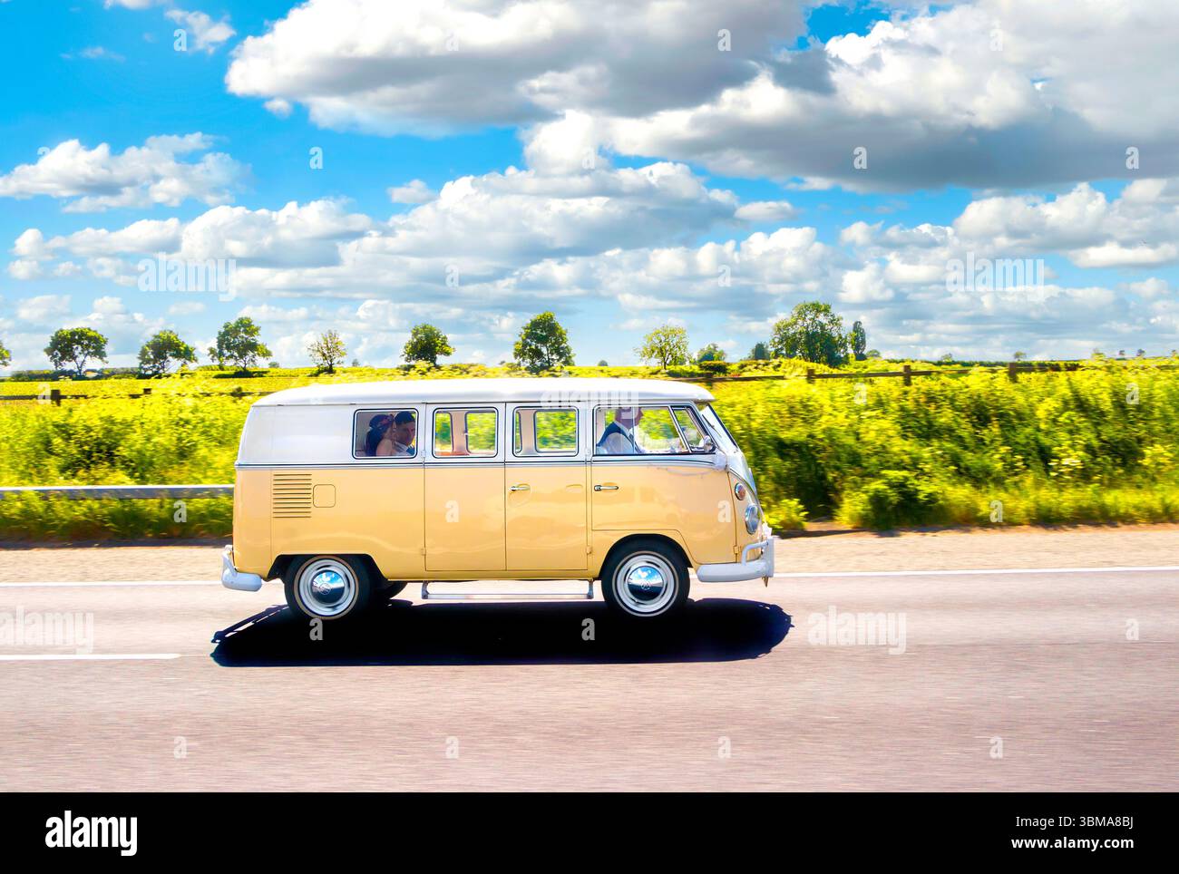 panning shot Vintage yellow two-tone VW Volkswagen transporter Type 2 ...