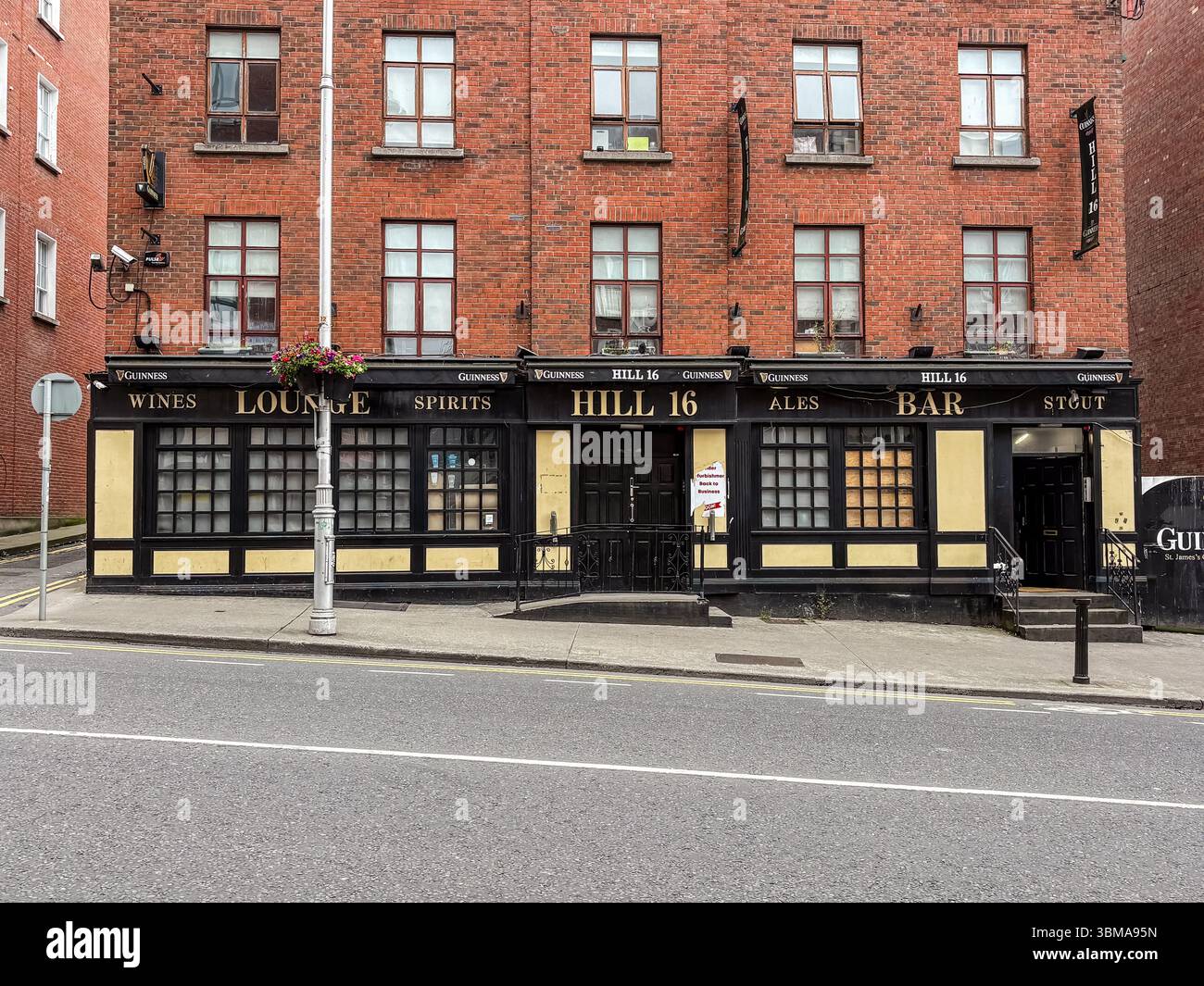 Hill 16 pub, an iconic Dublin pub with a traditional brick facade and storefront, located at ...