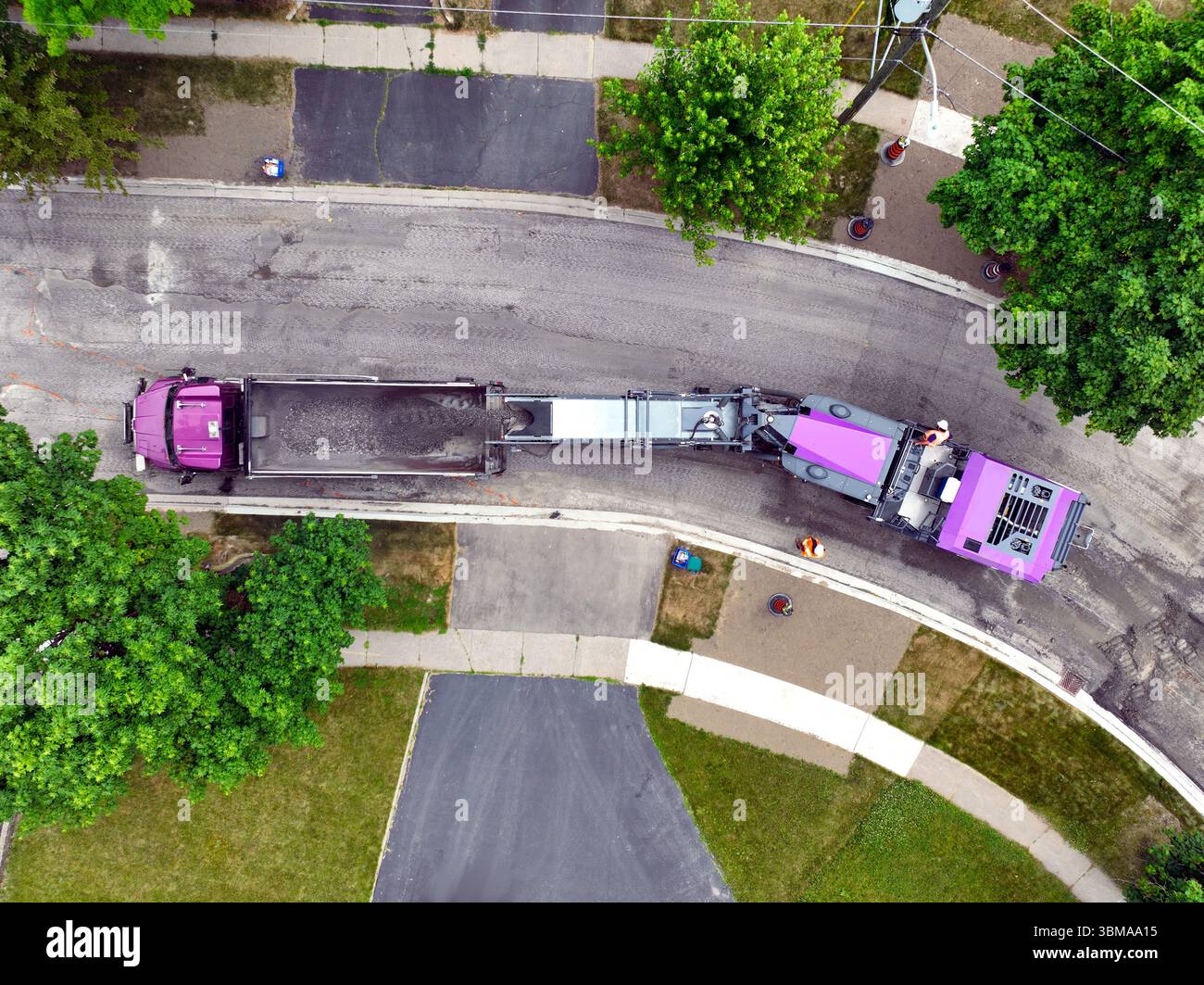 Overhead of road cold milling machine removing asphalt and transferring ...