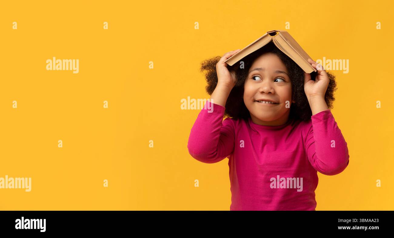 Education And Development. Funny Little Black Girl Hiding Under Opened ...