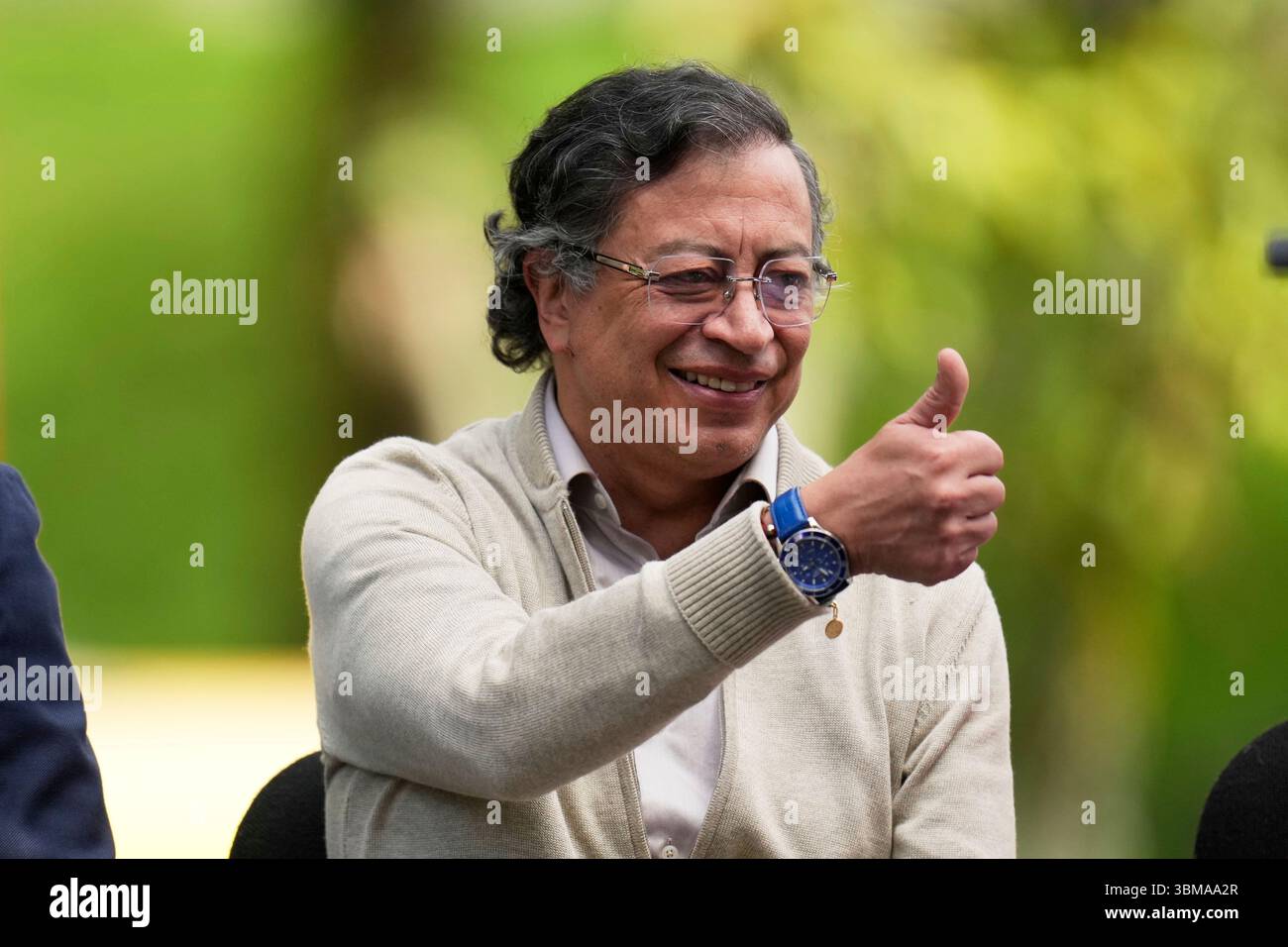 Colombia's President Gustavo Petro gives a thumbs up before signing a ...