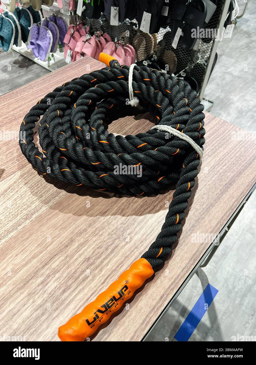 Kyiv, Ukraine - June 24, 2025: Black and orange battle rope coiled ...