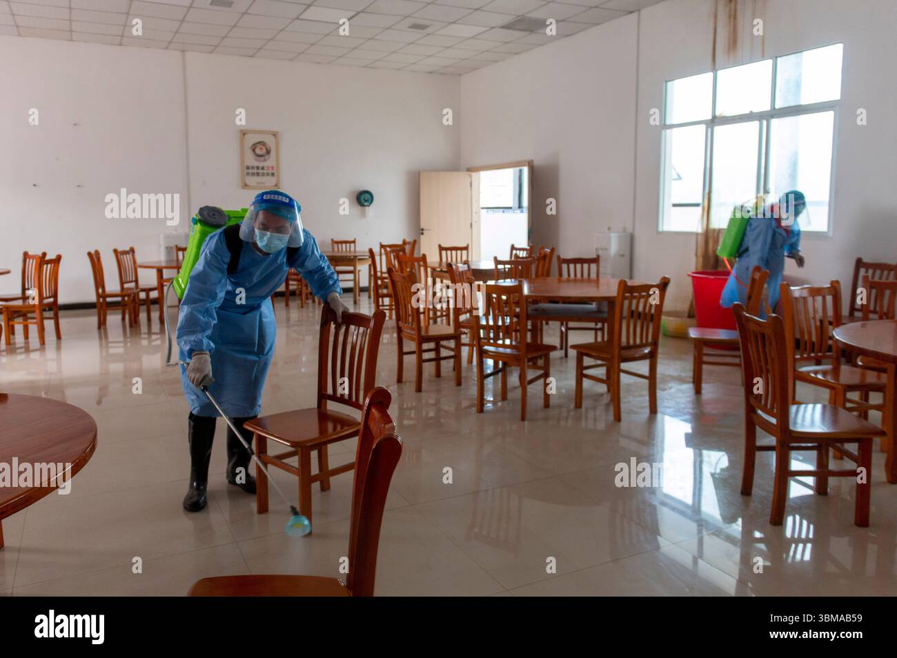 CONGJIANG, CHINA - JUNE 25, 2025 - Staff members disinfected the staff ...
