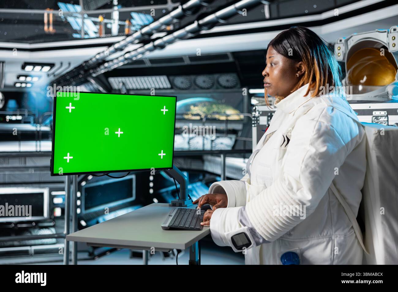 Astronaut reviewing spacecraft analytics on green screen monitor to ...