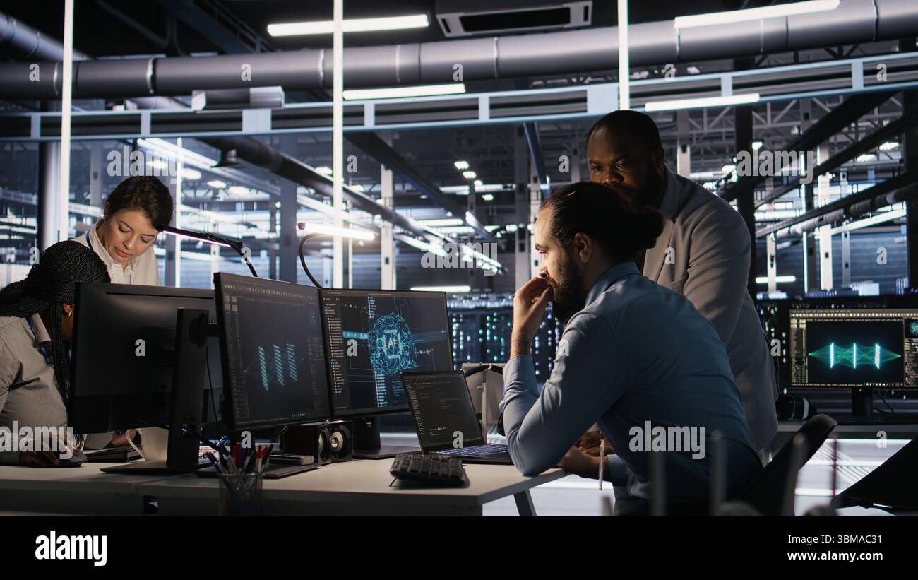 Data center engineers use laptop, collaborating on doing AI software ...