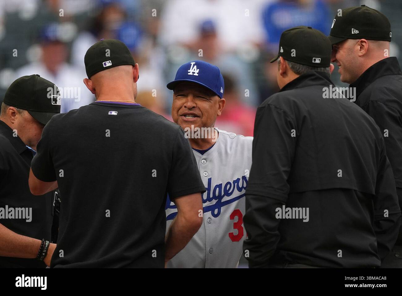 Los Angeles Dodgers manager Dave Roberts (30) greets Colorado Rockies ...