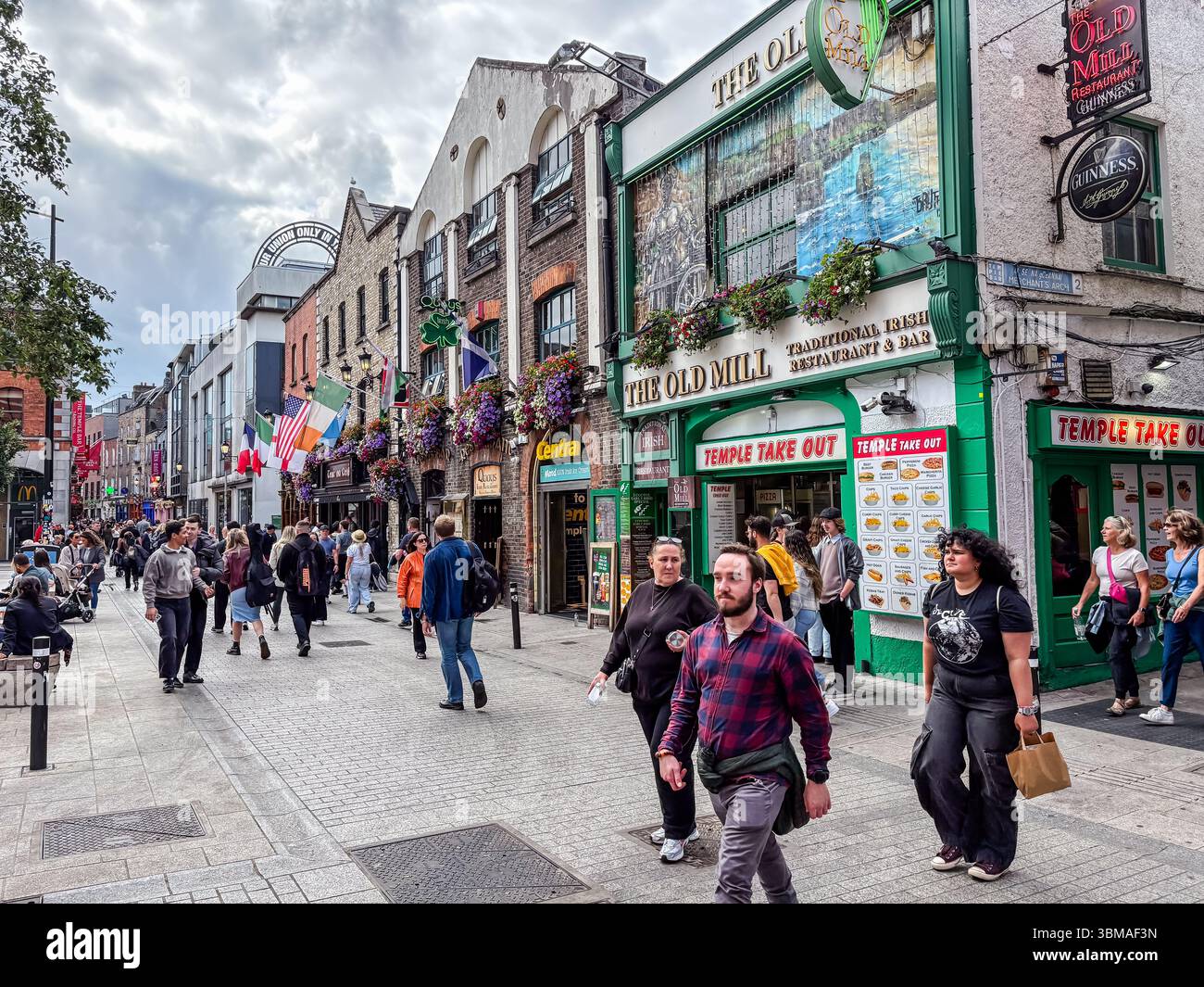 Temple Bar Area. Busy pedestrian street scene featuring traditional ...